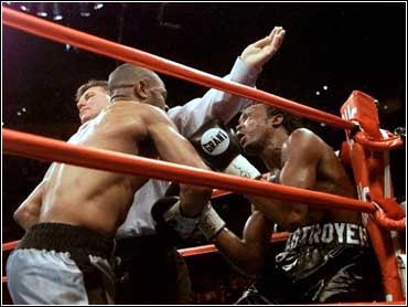 Jones Retains Belt With TKO - CBS News