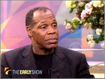 Glover Under Fire For Political Views - CBS News