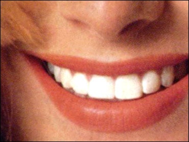 Flashing A Smile - CBS News