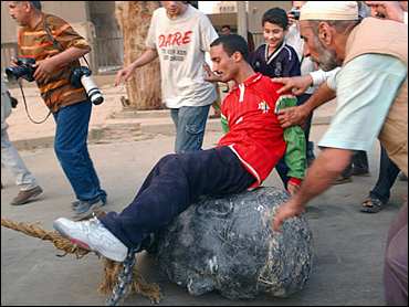 World Welcomes Toppling Of Statue - CBS News