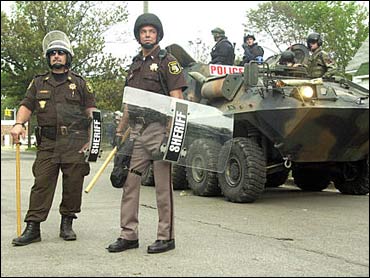 Curfew, Cops & Rain Cool Riots - CBS News