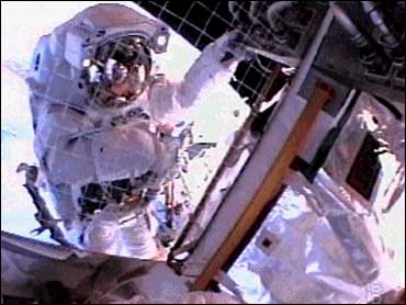 Astronauts Step Out Into Space - CBS News
