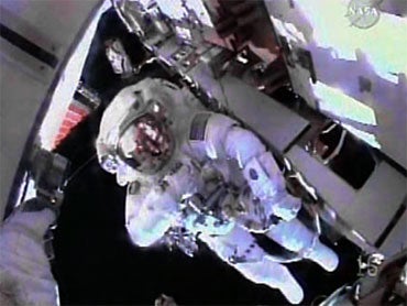Astronauts Cut Spacewalk Short - CBS News