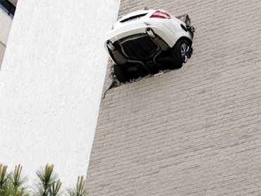 Man Crashes Car Through Garage Wall - CBS News