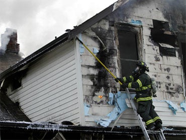 Firefighters Rescue 7 on Roof of Burning House - CBS News