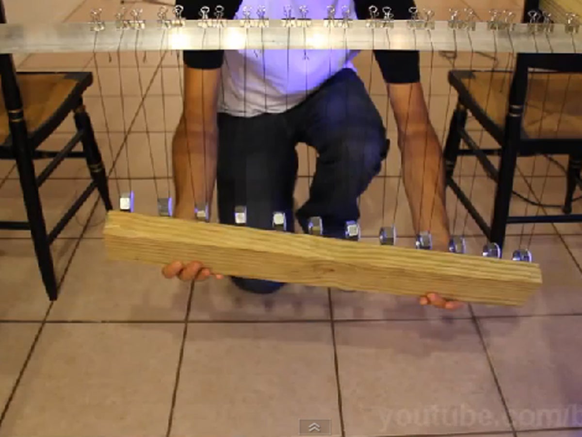 "Pendulum wave effect" shown using black light and music - CBS News