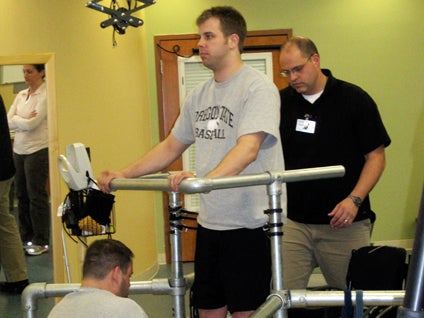 Paralyzed man stands up thanks to new therapy - CBS News