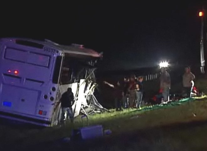 22 hurt when charter bus hits overturned truck - CBS News