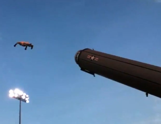 "Human Homerun" clears the fence at ballpark! - CBS News