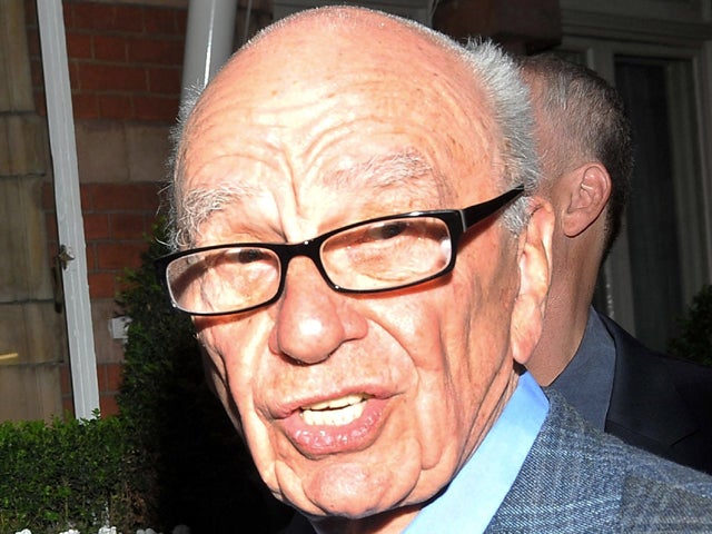 Murdochs defy parliament in phone hack probe - CBS News
