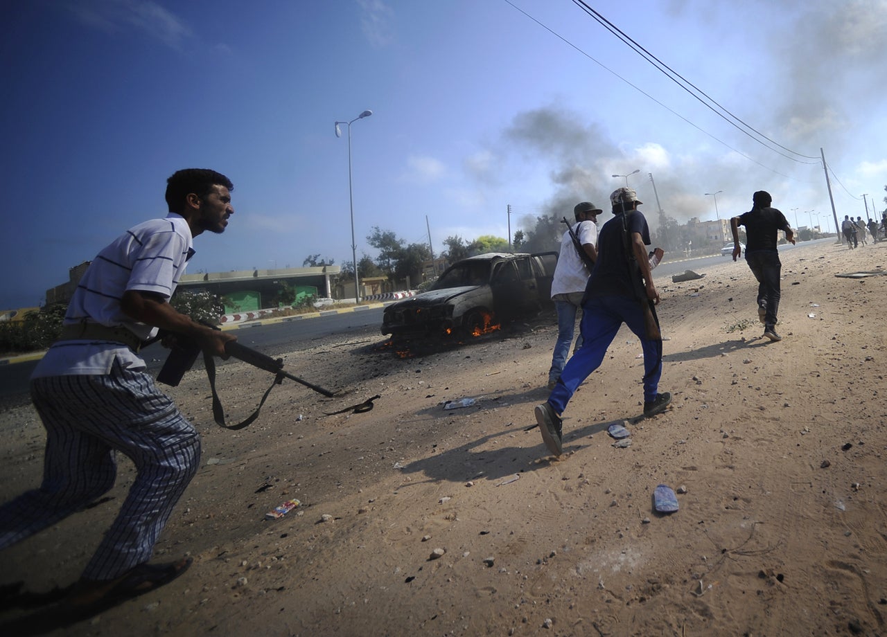 Muammar Qaddafi's regime is "clearly crumbling" - CBS News