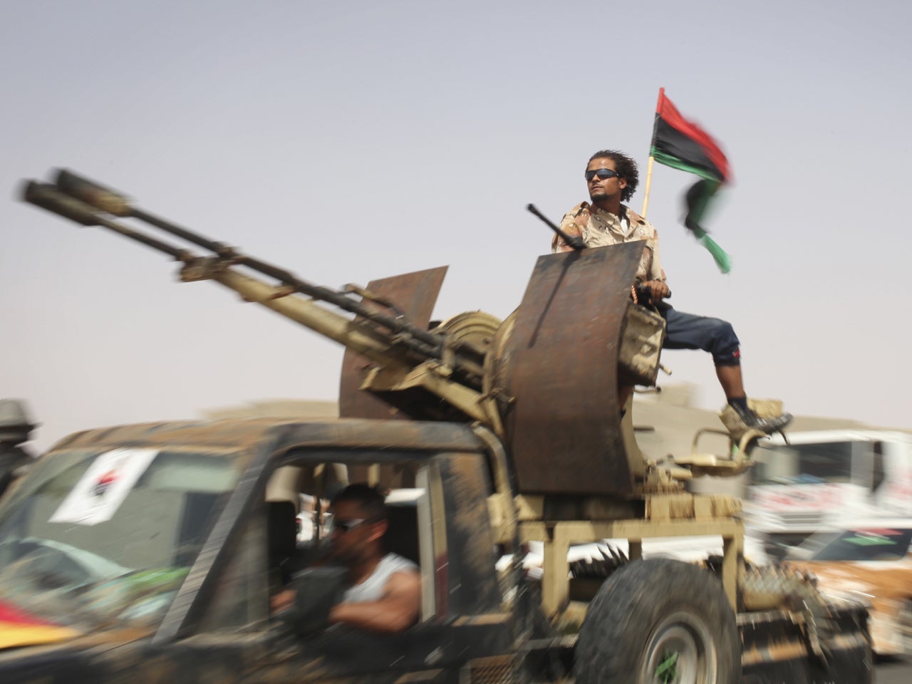 Libya rebels swarm around Qaddafi stronghold - CBS News