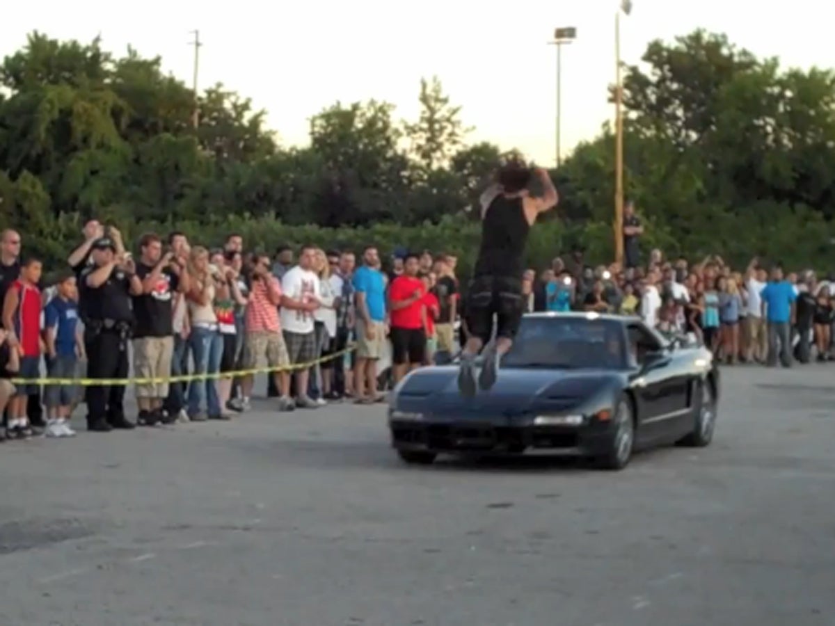 Man performs amazing flip over a speeding car - CBS News