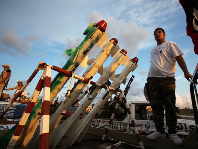 Guns, bureaucracy thrive in post-Qaddafi Libya - CBS News