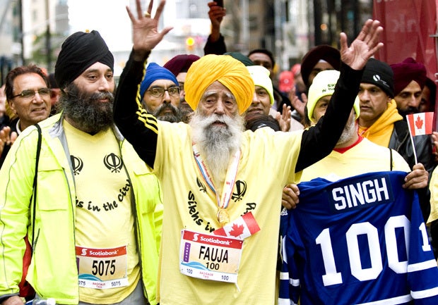 100-year-old finishes marathon, earns record - CBS News