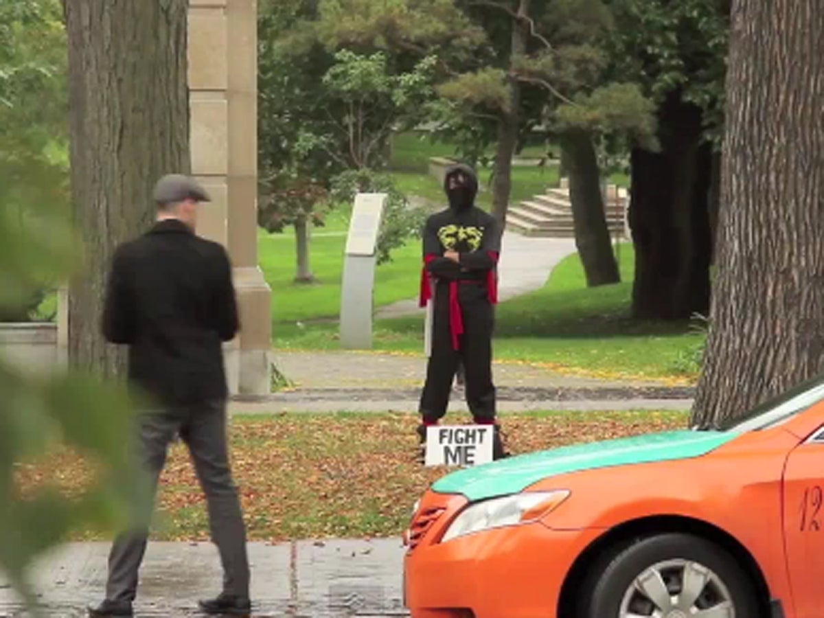 Ninja standing in front of sign that says "Fight Me" leads to ...