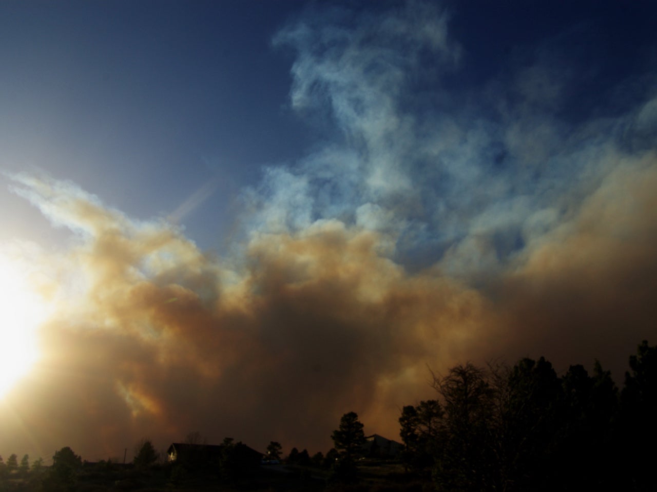2 dead in Colorado wildfire area as homes burn - CBS News