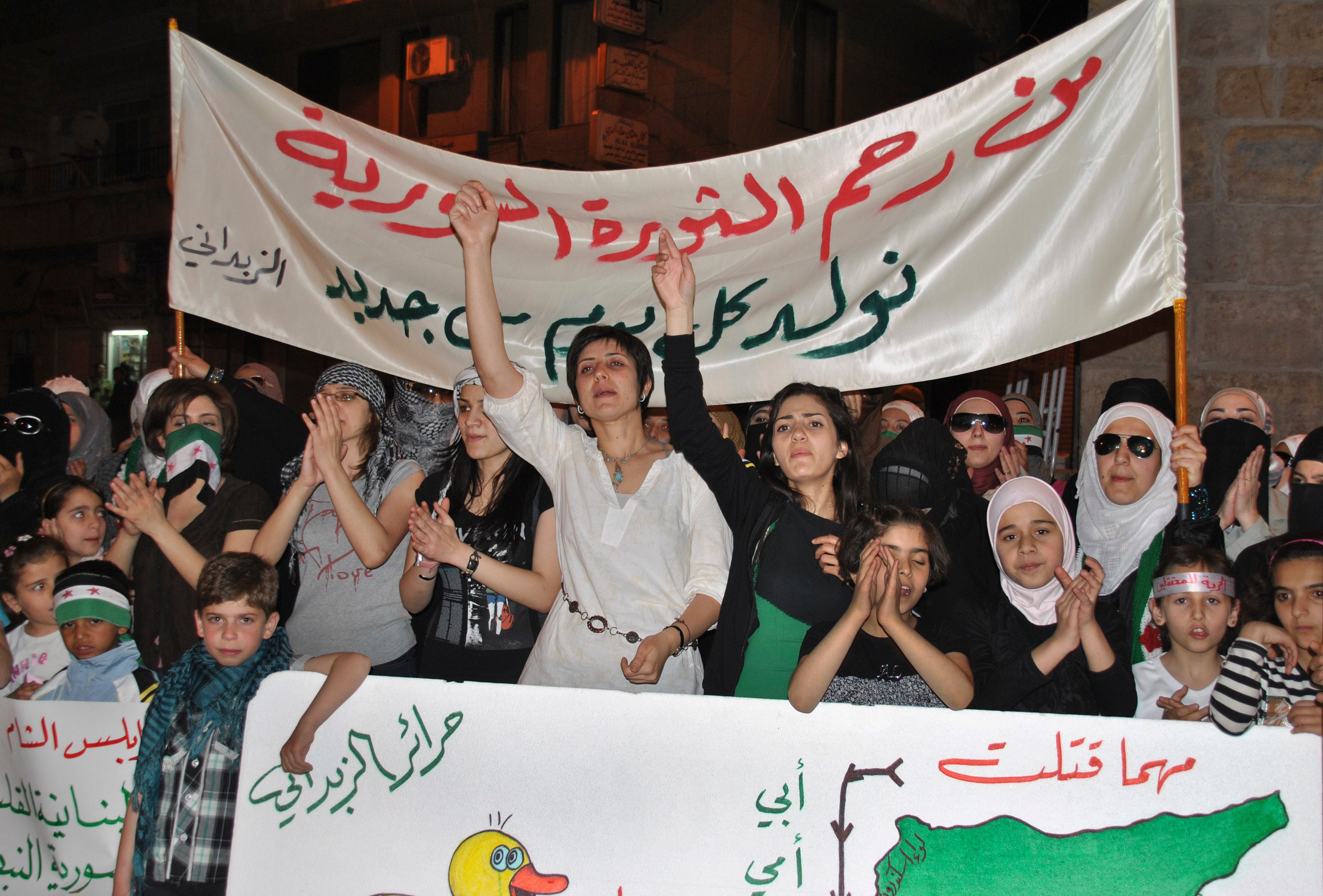 Largest protest yet in Syrian city loyal to Assad - CBS News