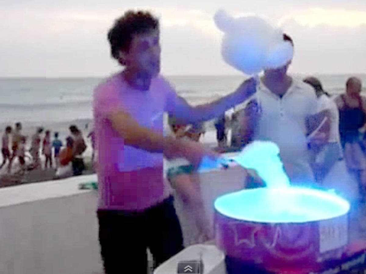 Dancing street artist is the king of cotton candy - CBS News