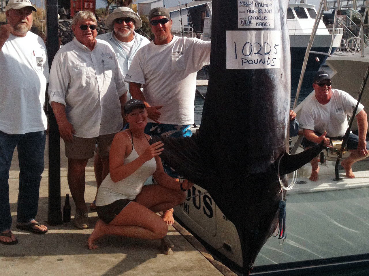 Woman just misses record half-ton marlin catch - CBS News