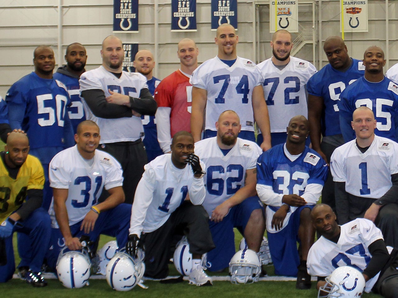 Colts players' shave heads in support of ailing coach - CBS News