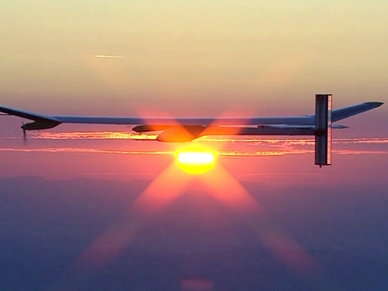 Solar-powered plane aims to fly around the world - CBS News
