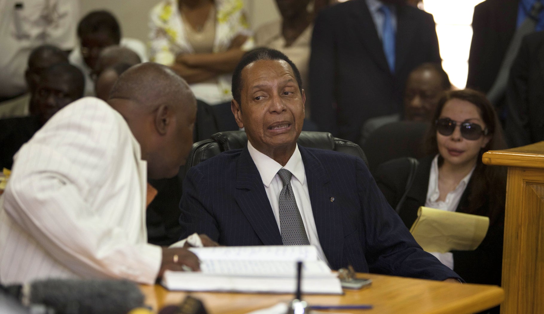 Haiti's "Baby Doc" appears in court after ignoring summons - CBS News