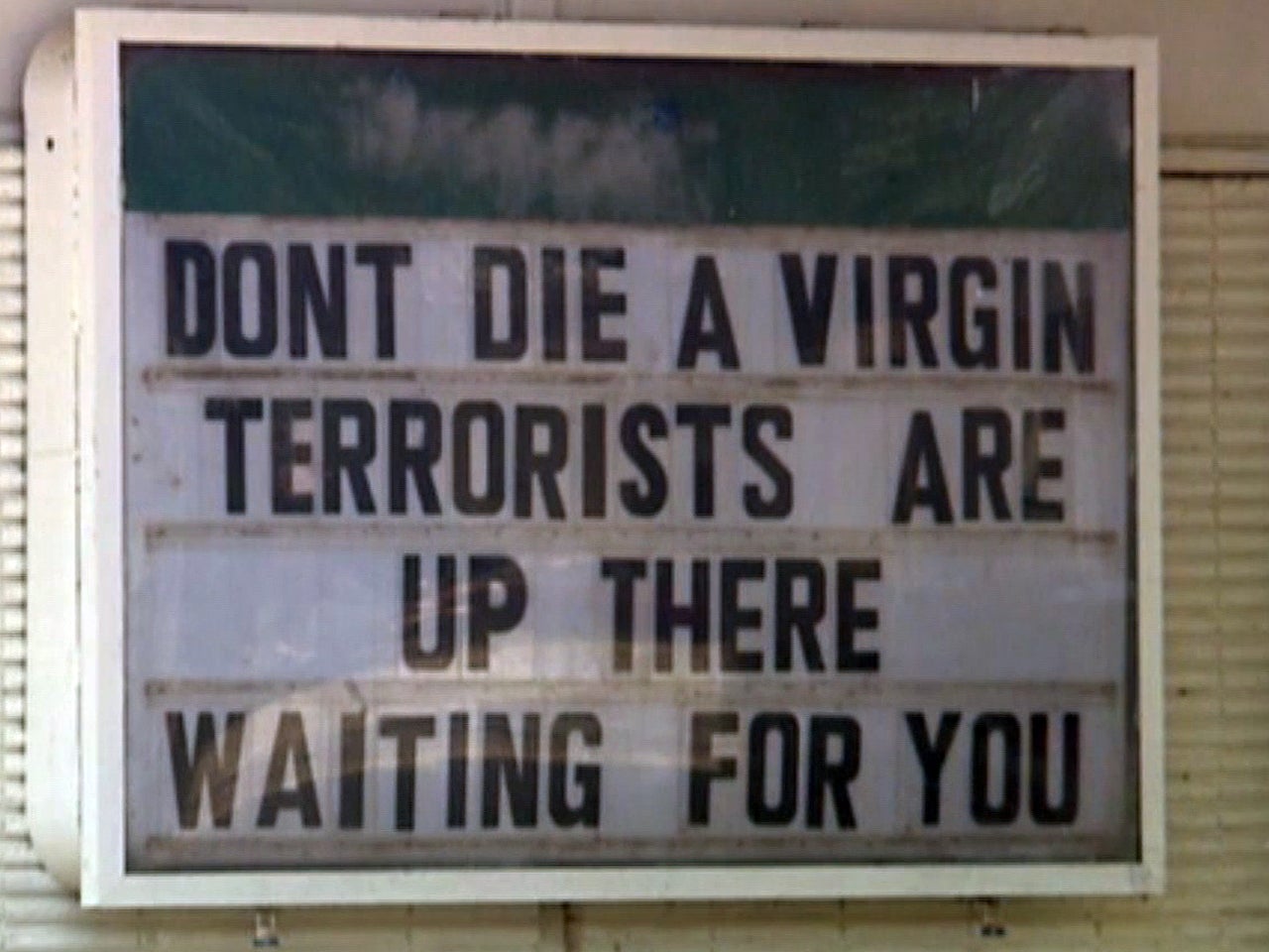 "Don't die a virgin" sign stops traffic at gas station - CBS News