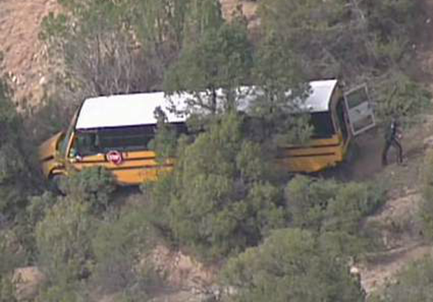 N.M. school bus rolls over; driver dead, 9 kids hurt - CBS News