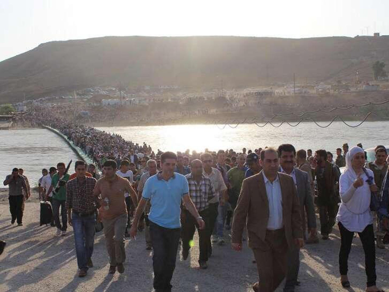 Syria Kurdish militias battle al Qaeda fighters, driving civilians ...