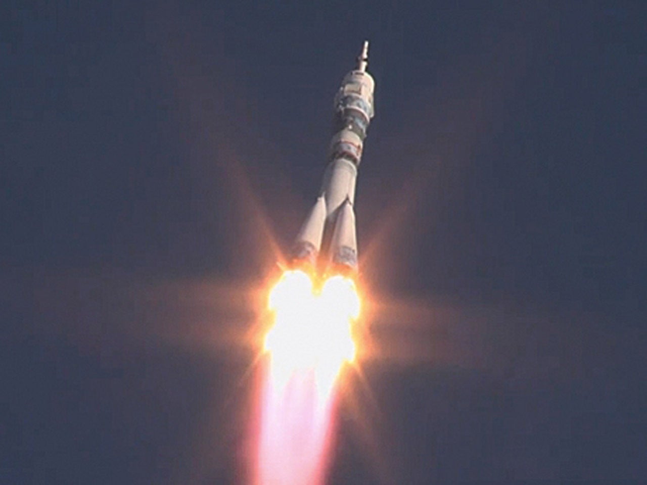 Rocket carrying Olympic torch docks with space station - CBS News
