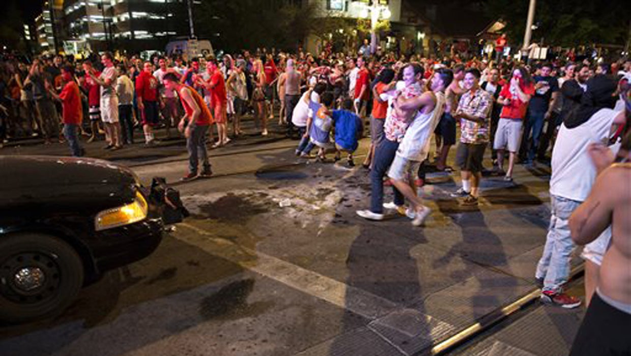 Police intervene after University of Arizona fans riot in the street ...