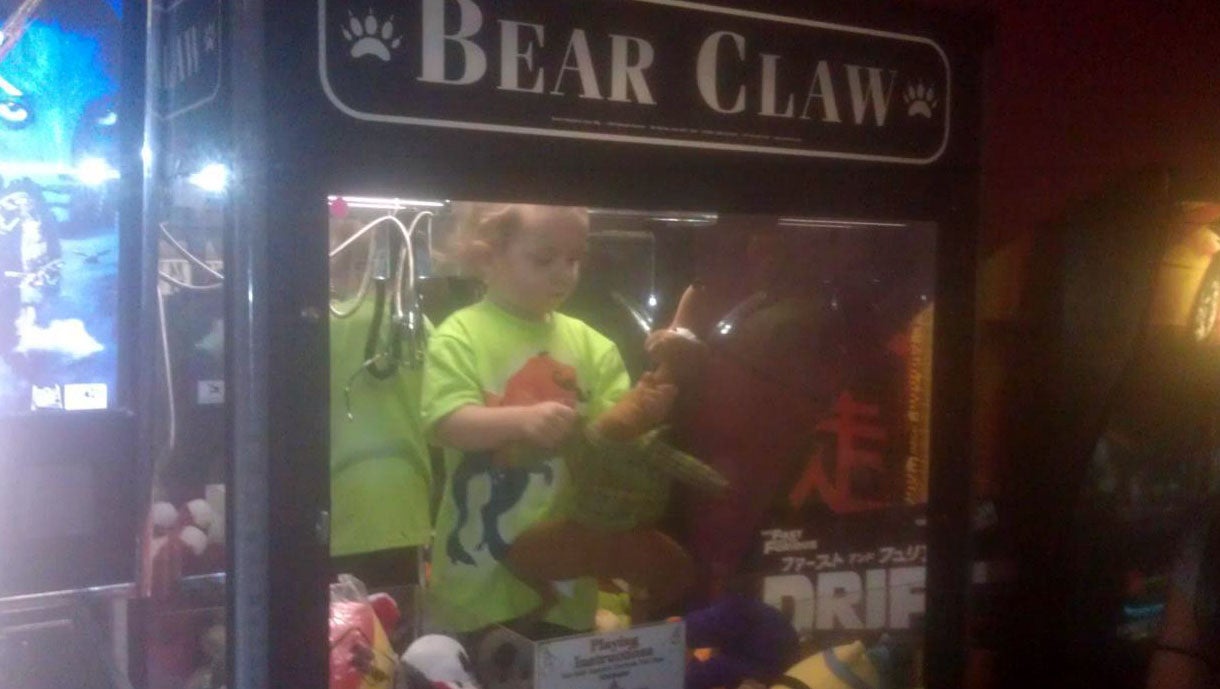 Missing child found stuck inside claw machine - CBS News