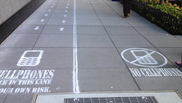 City gets a "No Cellphones" walking lane, for now - CBS News