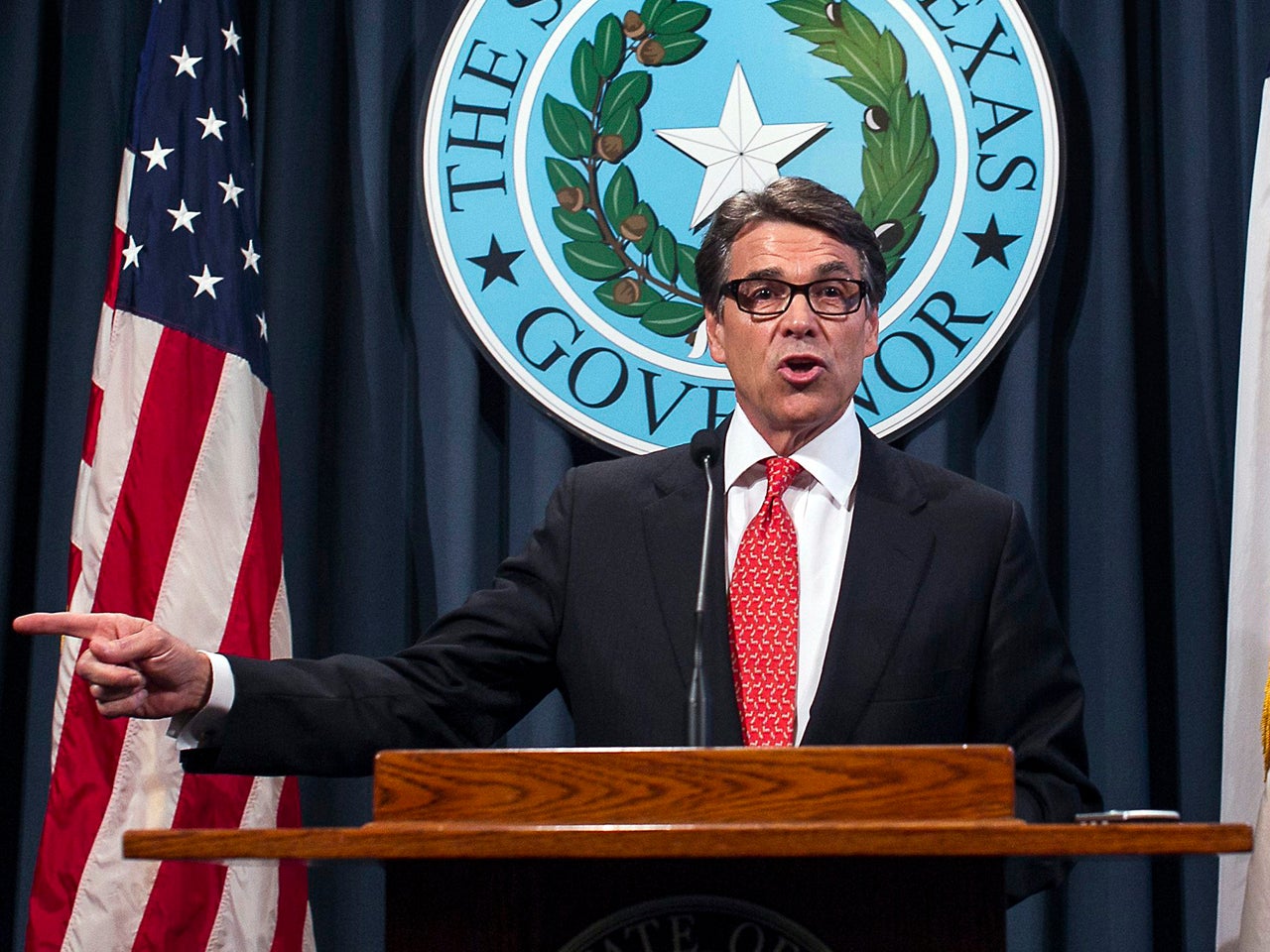 Rick Perry to turn himself in on abuse of power charges - CBS News