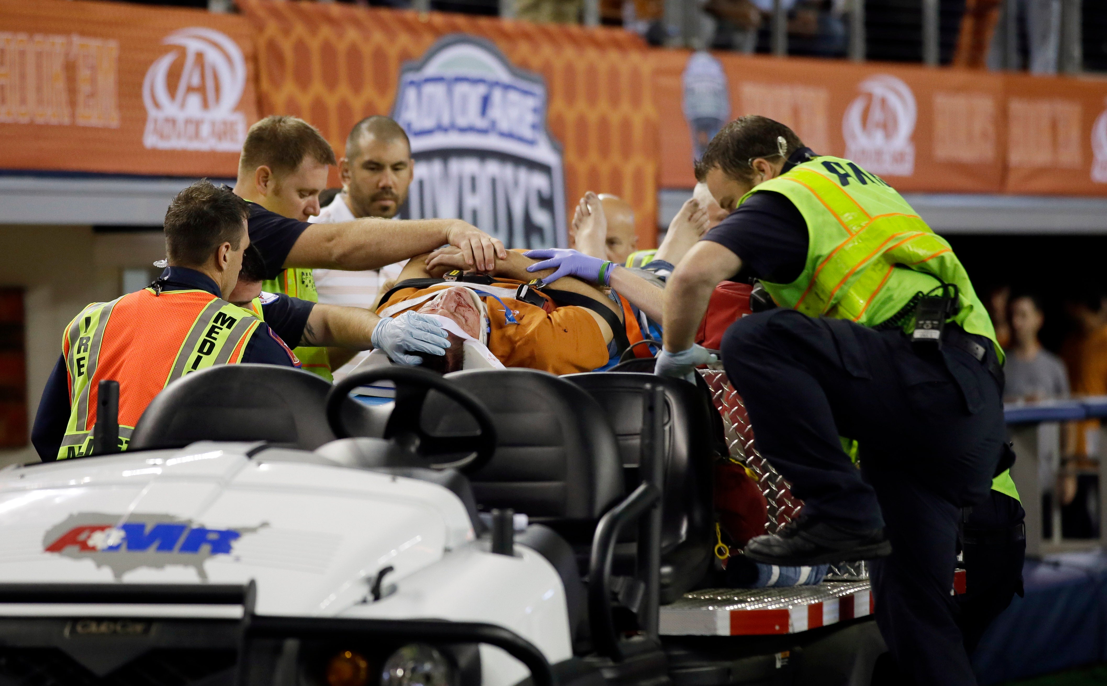 Fan in critical condition after fall at Texas-UCLA game - CBS News