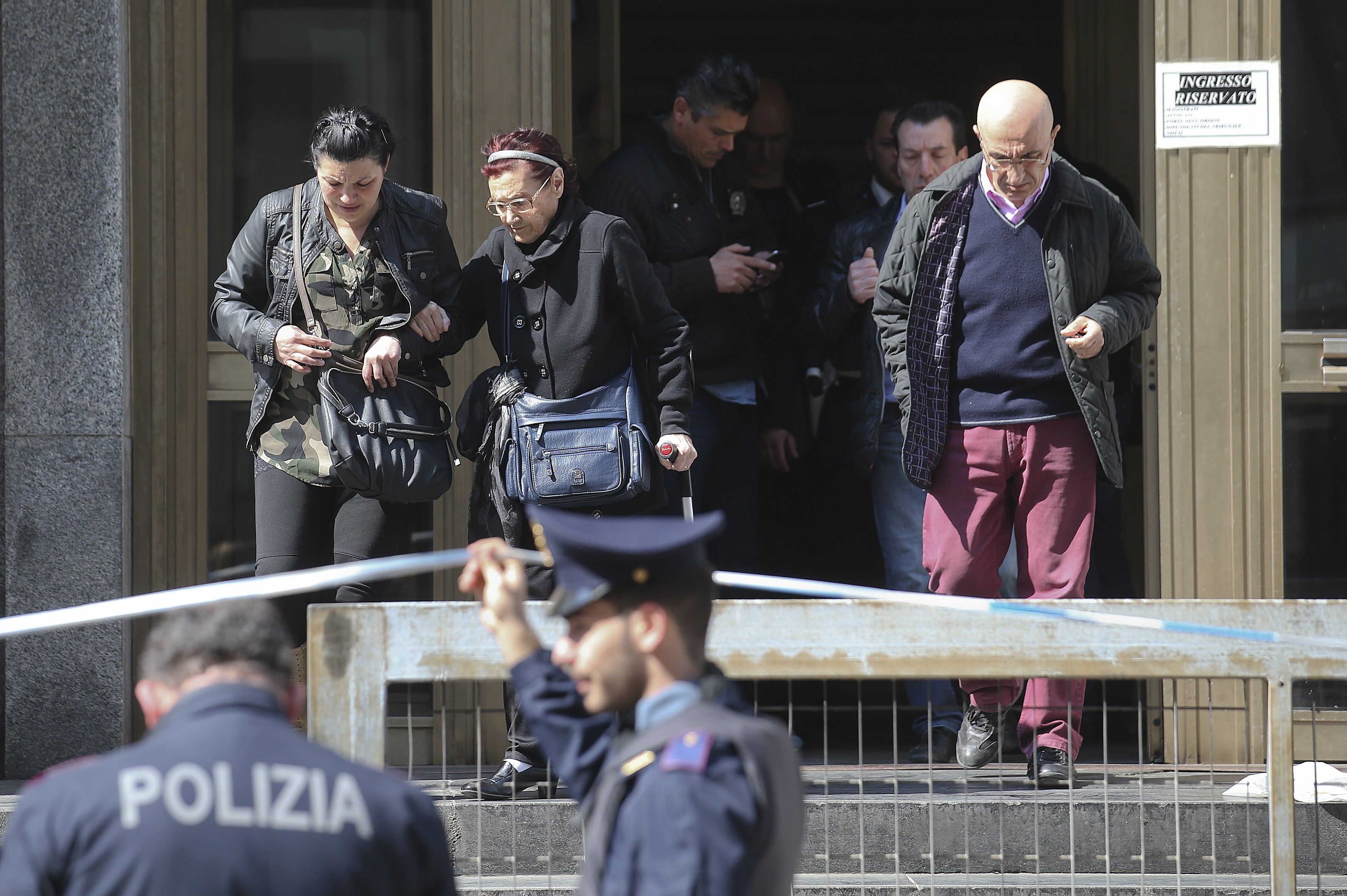 Man kills his lawyer, judge, co-defendant in Milan court - CBS News