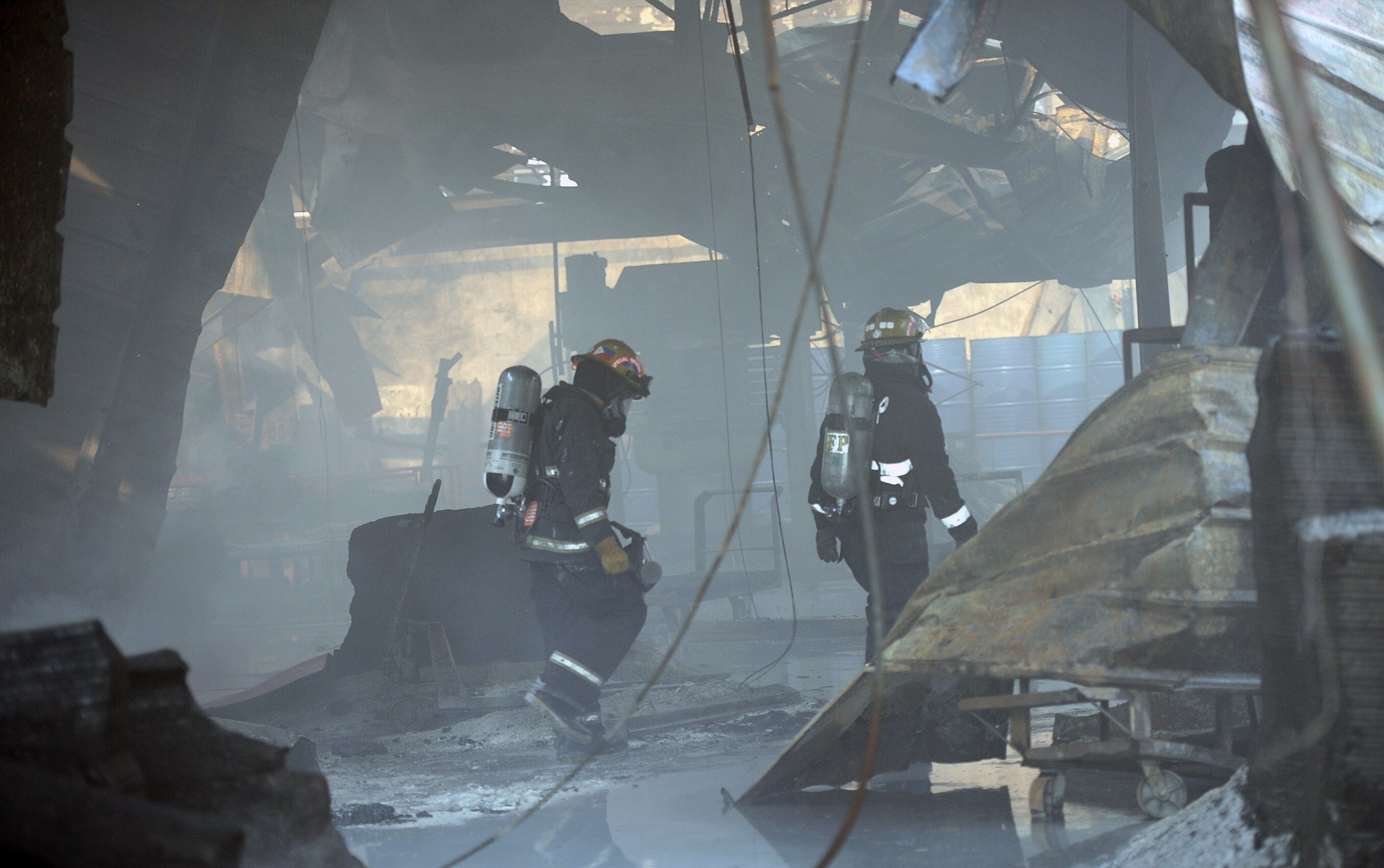 Philippines factory fire trapped workers on 2nd floor of Kentex rubber ...