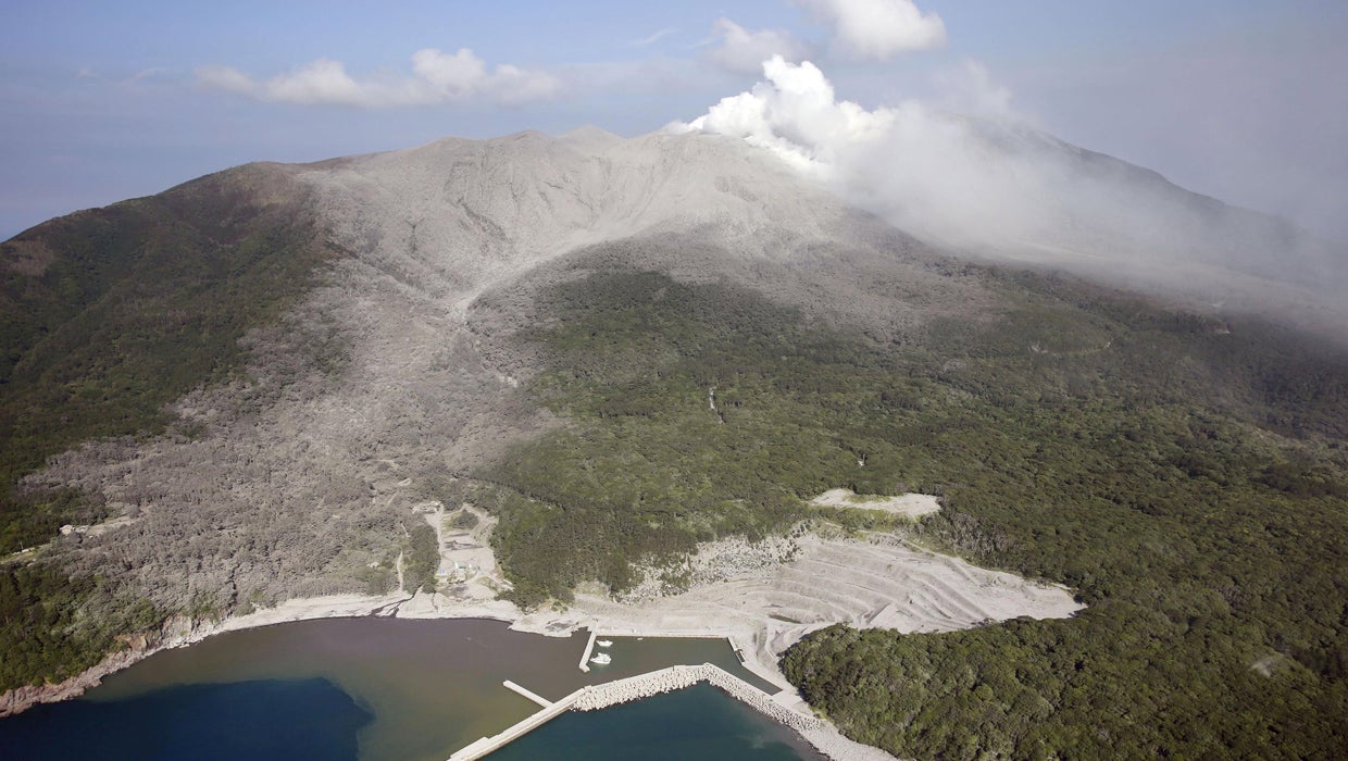 Volcano erupts in Japan, spewing ash miles high - CBS News