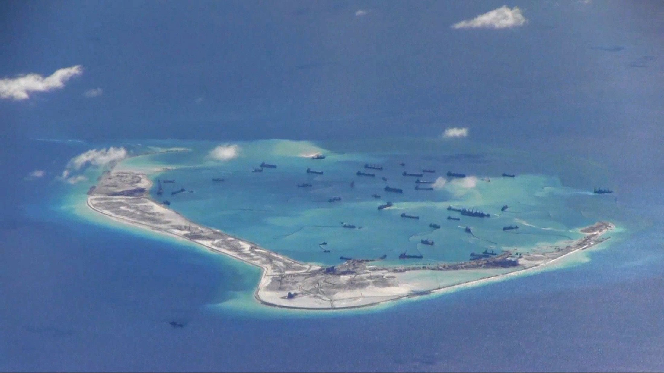 Philippines official says China constructing artificial islands for ...