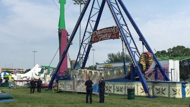Man dives under carnival ride in apparent suicide - CBS News