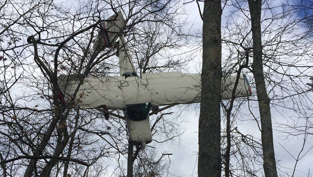 Pilot, 87, unhurt after crashing plane into trees - CBS News