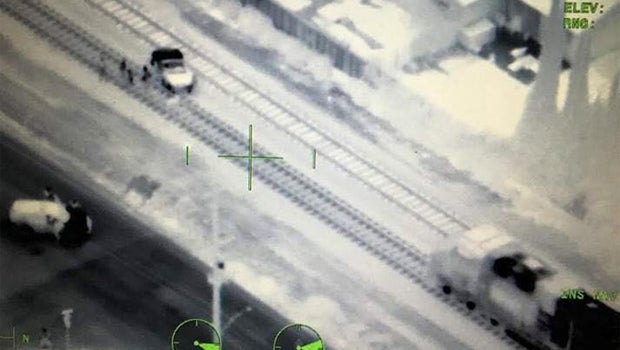 Police chopper stops train from colliding with stalled car on tracks ...