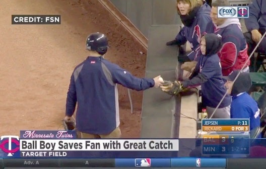 Caught on camera: Twins ball boy makes incredible catch, saves fan ...