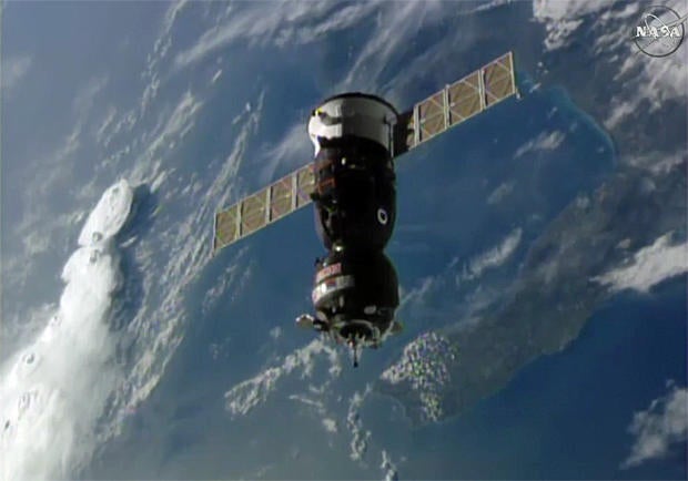 Upgraded Soyuz brings crew of three to space station - CBS News