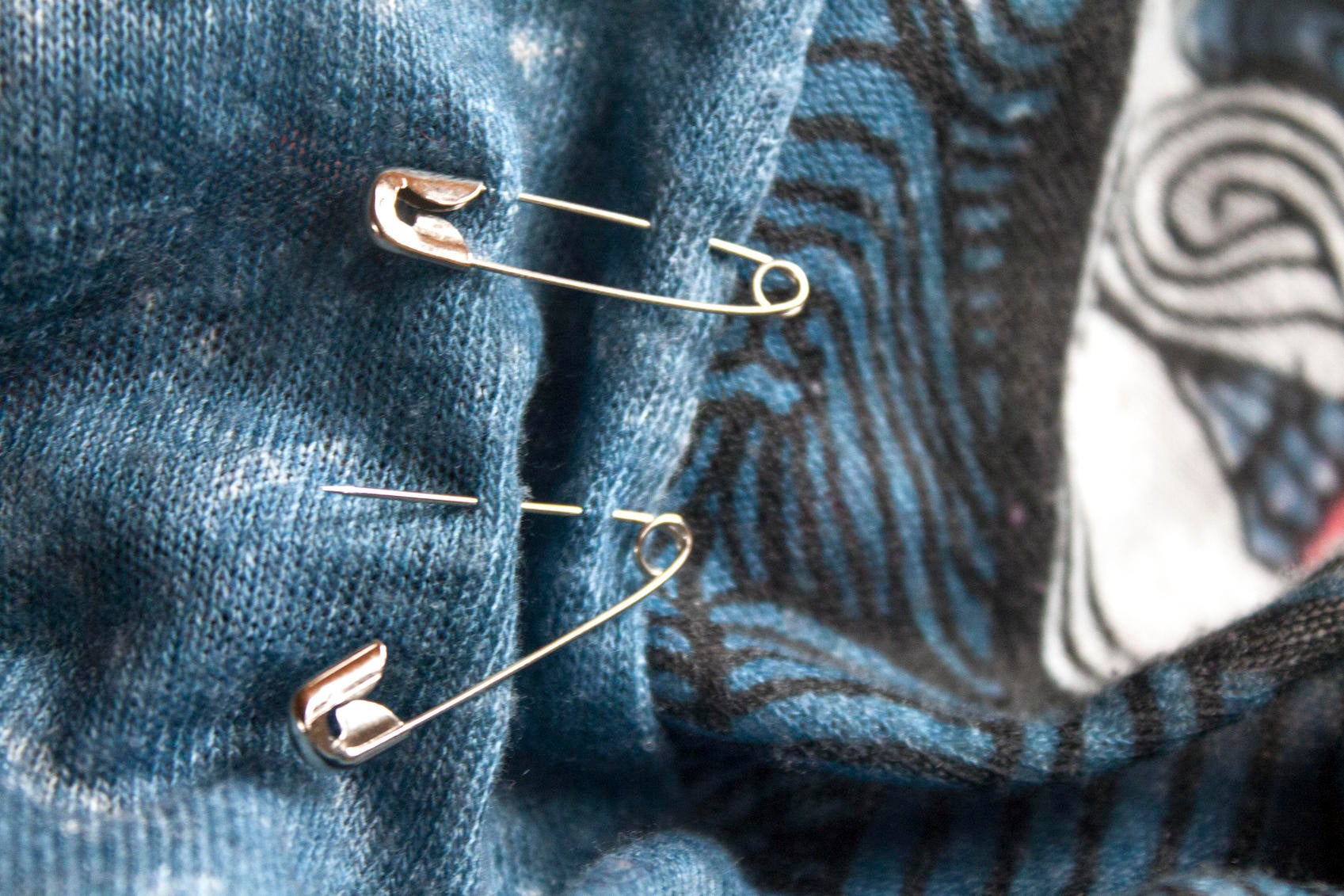 Critics jab safety pin movement amid Trump presidency fears - CBS News