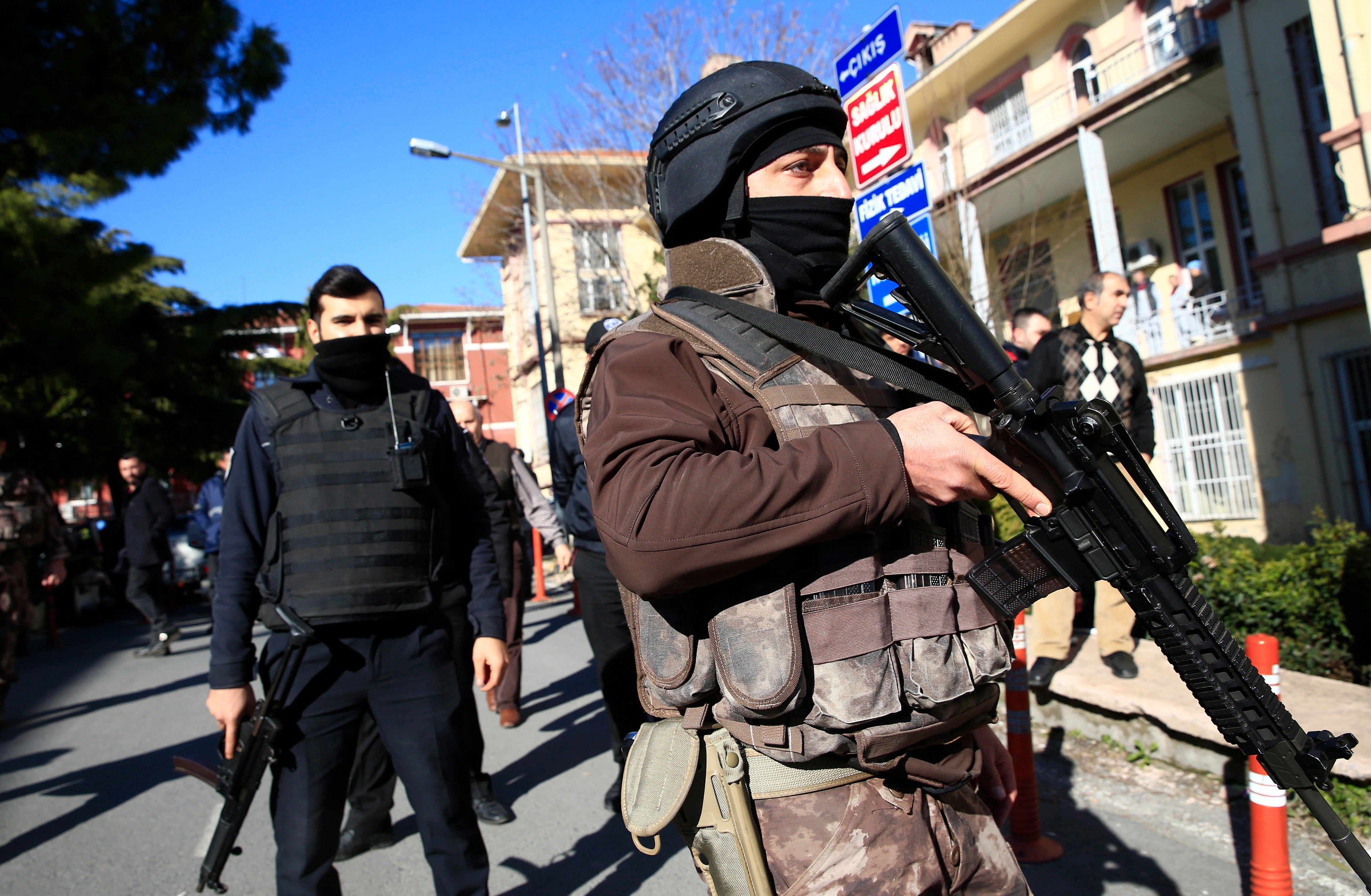 Turkey police officer barricades self in hospital with gun threatening ...