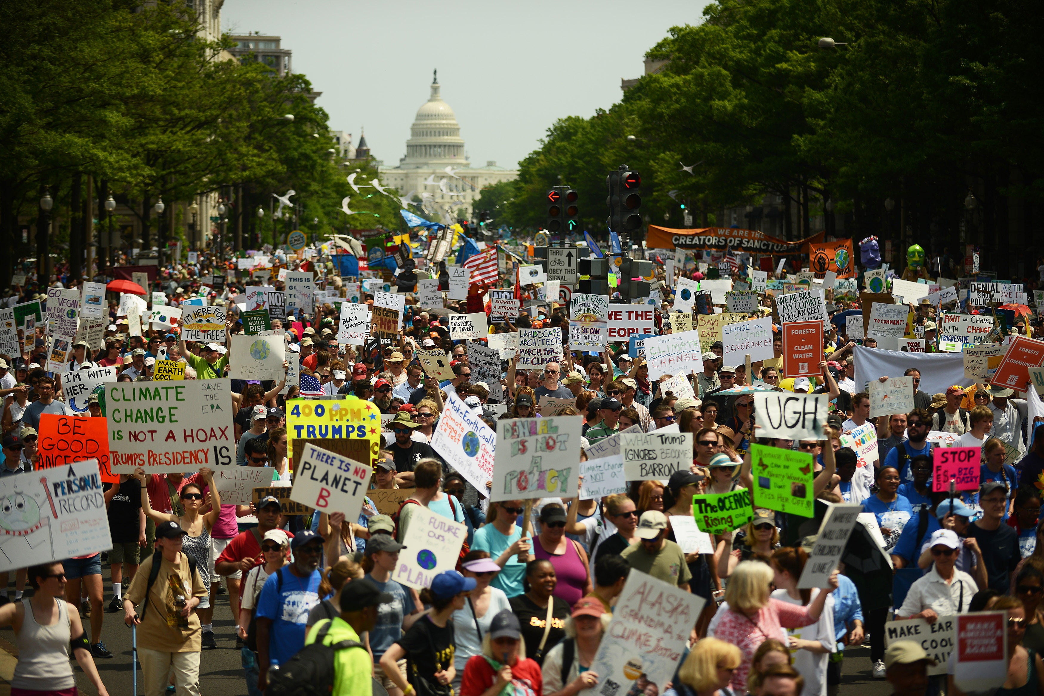 Climate march: Protesters demand action on climate change to mark Trump ...