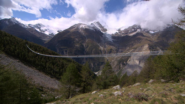 World's longest suspension footbridge thrills hikers in the Swiss Alps ...