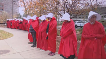 "Handmaids" protest Pence in Colorado - CBS News